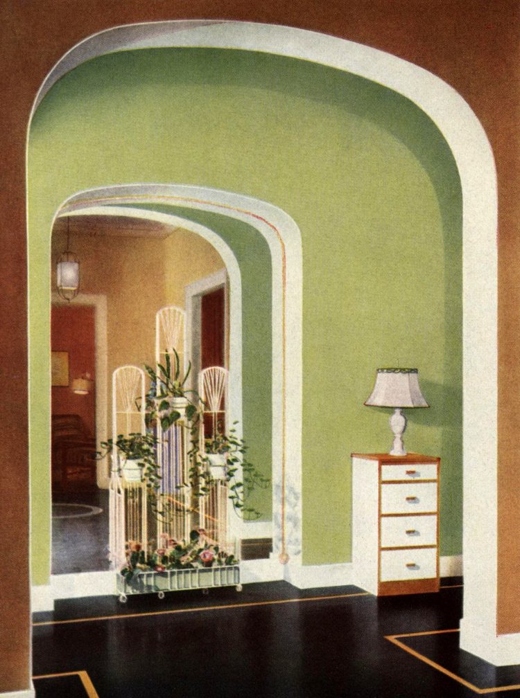 This elegant Victorian-style entry hall had rich red patterned walls ...