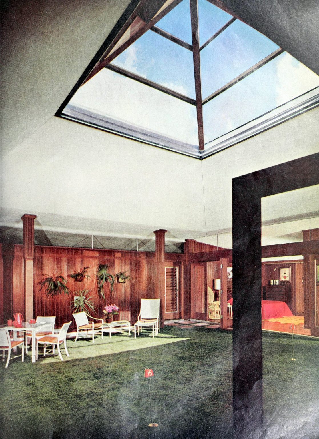 A grassy vintage atrium/courtyard filled the center of this 60s house ...