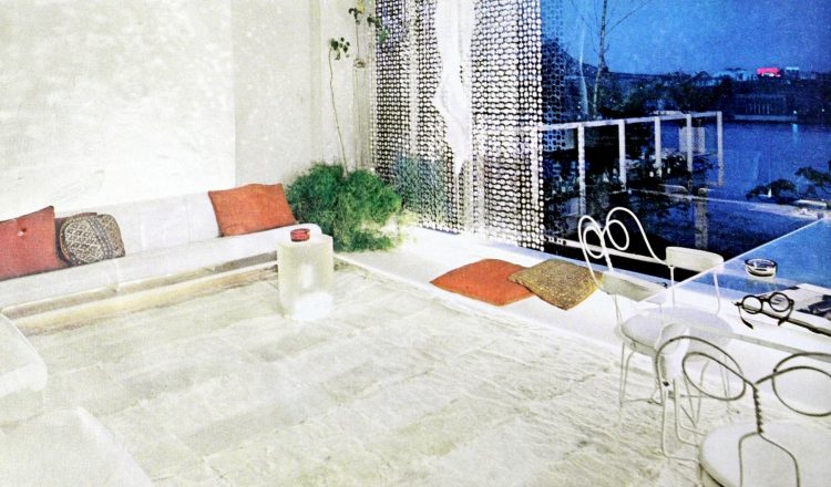 A freestanding fireplace was the center of this simple retro mod living ...