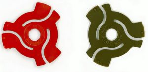 Remember 45 rpm record inserts? See a bunch of those little spindle ...