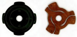 Remember 45 rpm record inserts? See a bunch of those little spindle ...