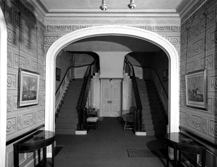 An elegant double staircase graced this restored historic home - Click ...